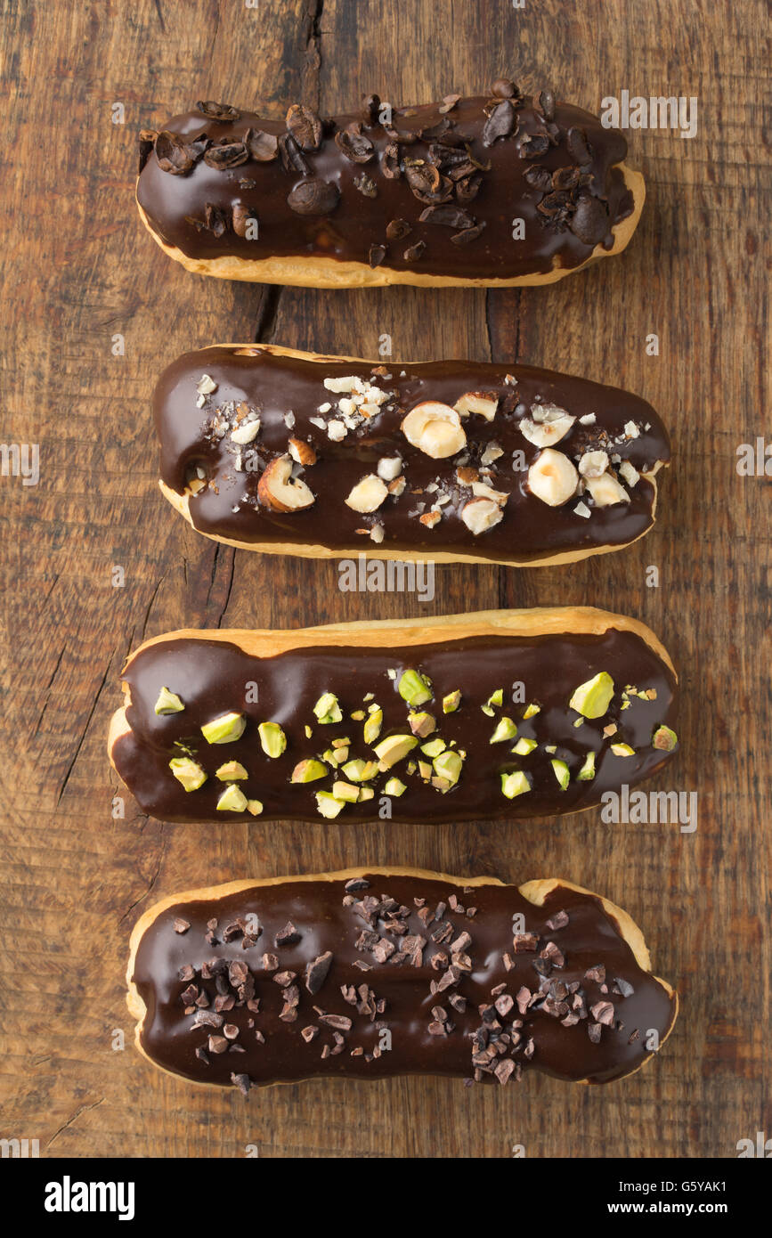 Chocolate eclairs with toppings Stock Photo - Alamy