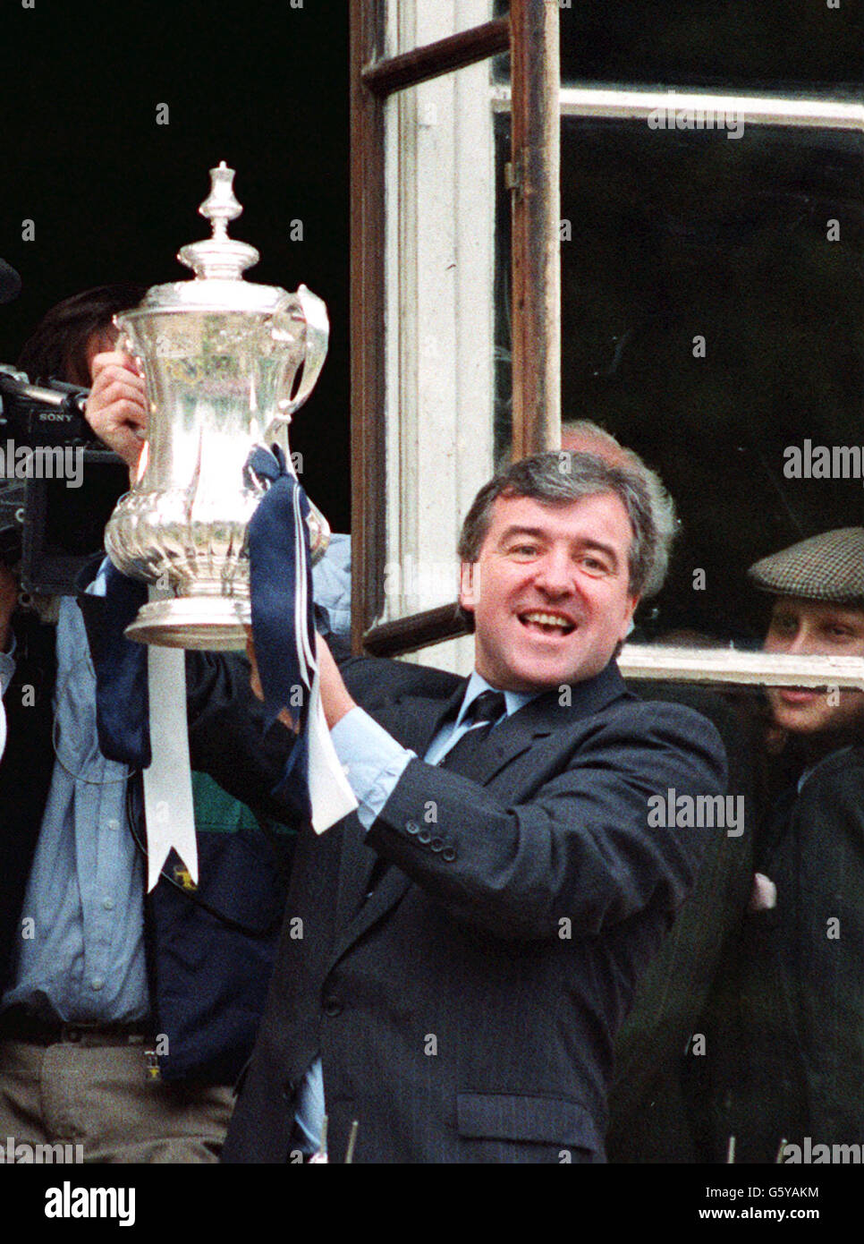 Spurs manager Terry Venables proudly shows the FA Cup to the crowds of ...