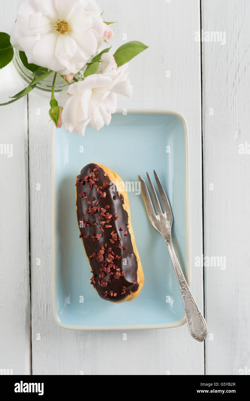 Chocolate raspberry eclair Stock Photo - Alamy