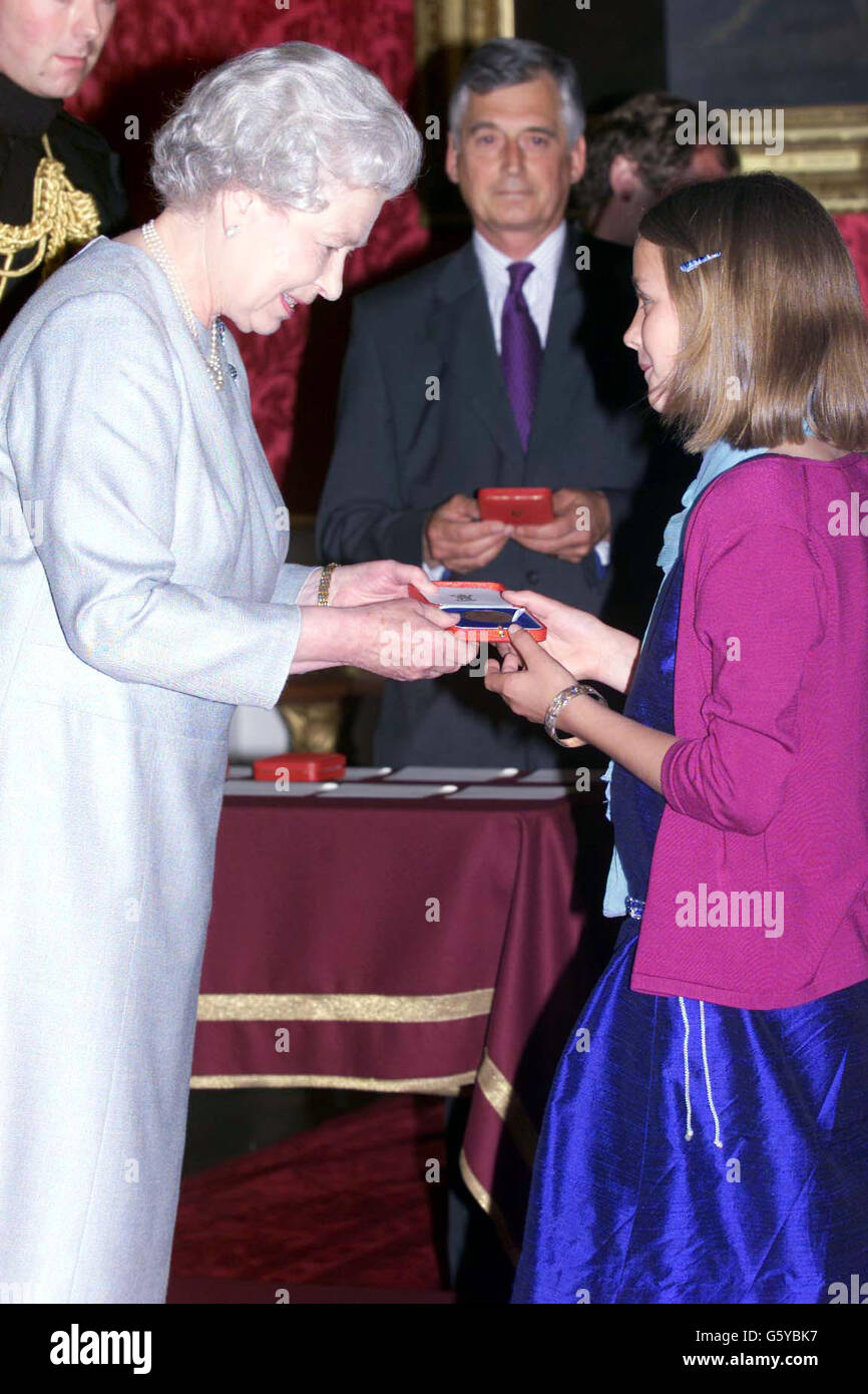 Medal from queen elizabeth ii at buckingham palace hi-res stock ...