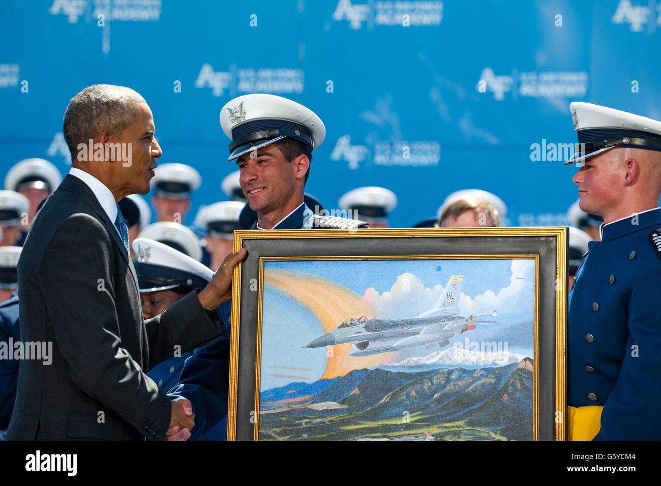 U.S President Barack Obama is presented with a gift from cadets Kristov ...