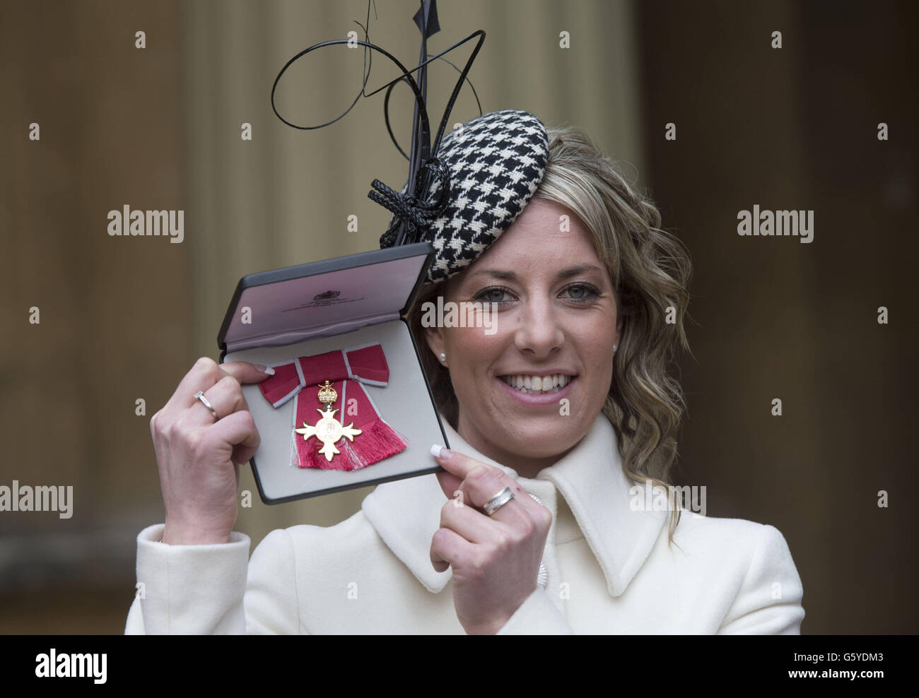 Charlotte Dujardin proudly holds her OBE award after the Investiture ...