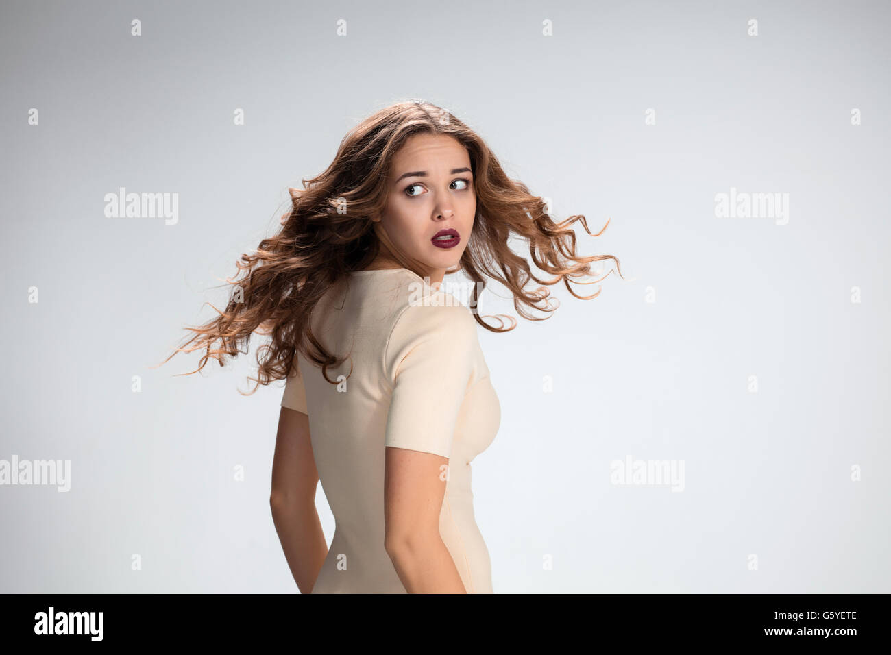 The young woman's portrait with frightened emotions Stock Photo - Alamy