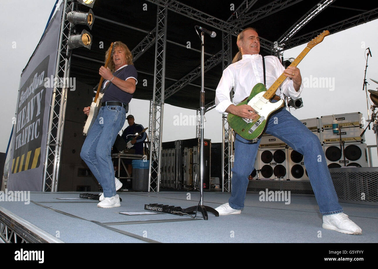 Rick Parfitt (left) and Francis Rossi of Status Quo play for fans and ...