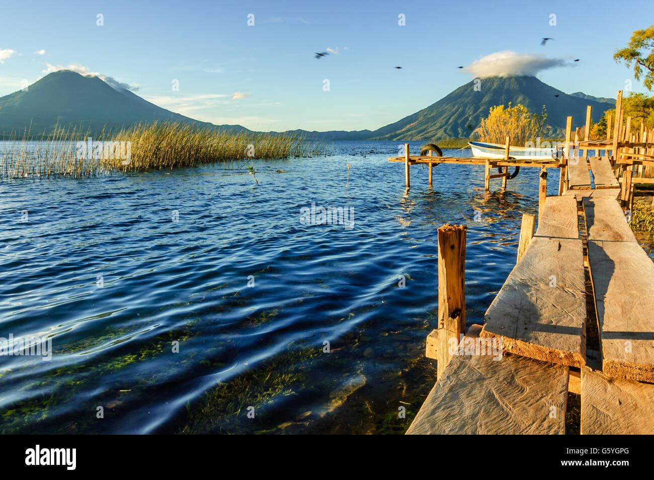 Early morning light on three volcanoes: Toliman volcano (Atitlan ...