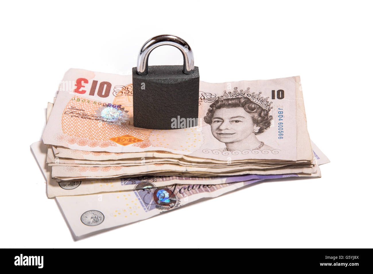 A close-up photograph of Sterling currency and padlock Stock Photo - Alamy