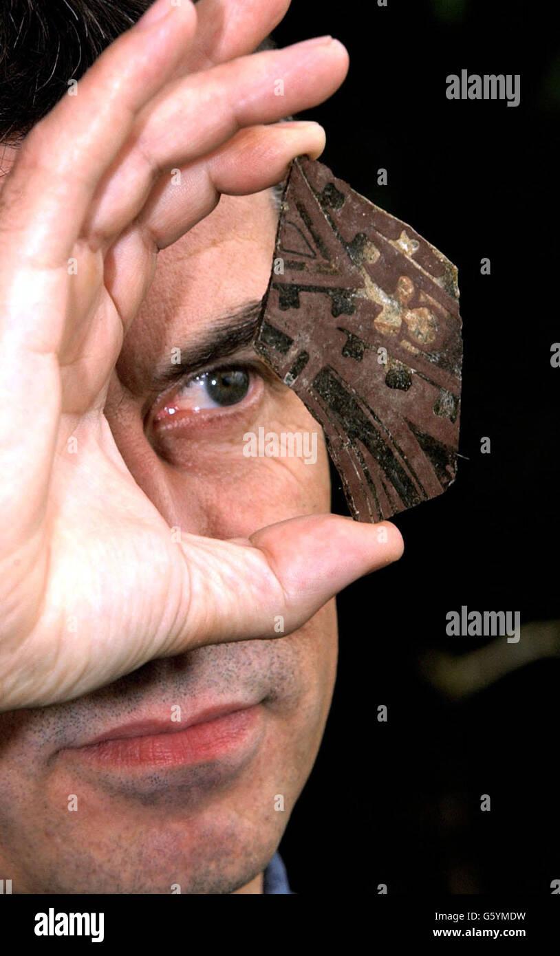 Dr Paul Stamper, English Heritage Ancient Monuments Inspector, holds a ...