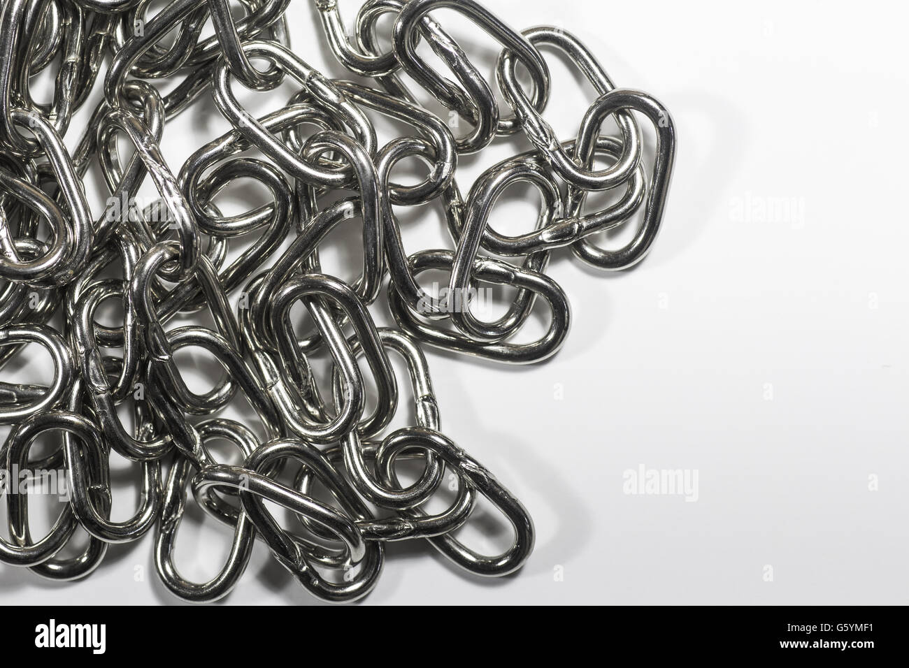 Silver colored chain on white background Stock Photo - Alamy