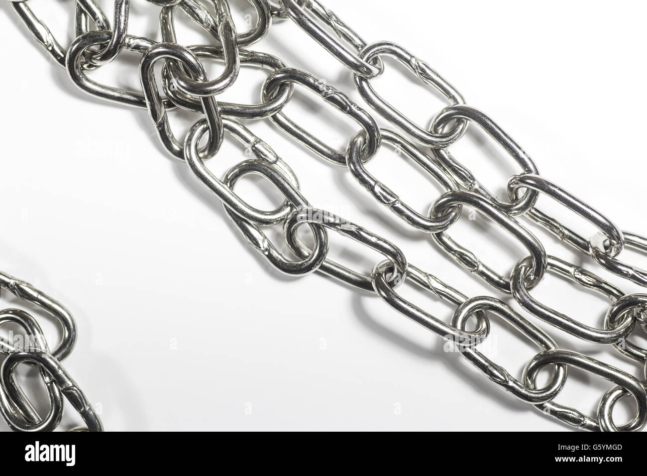 Silver coloured chain on white background Stock Photo - Alamy