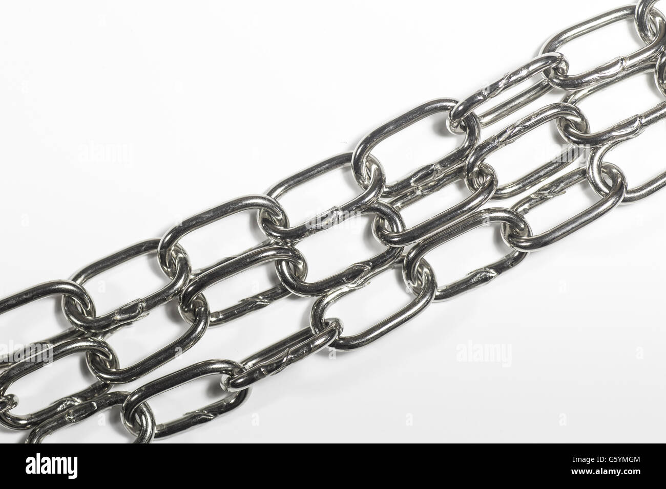 3 pieces of chain across diagonal of frame Stock Photo - Alamy