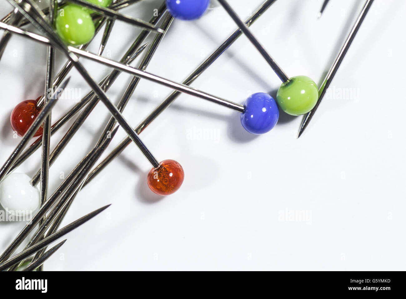Close Up of Coloured Glass Head Sewing Pins Stock Photo - Alamy