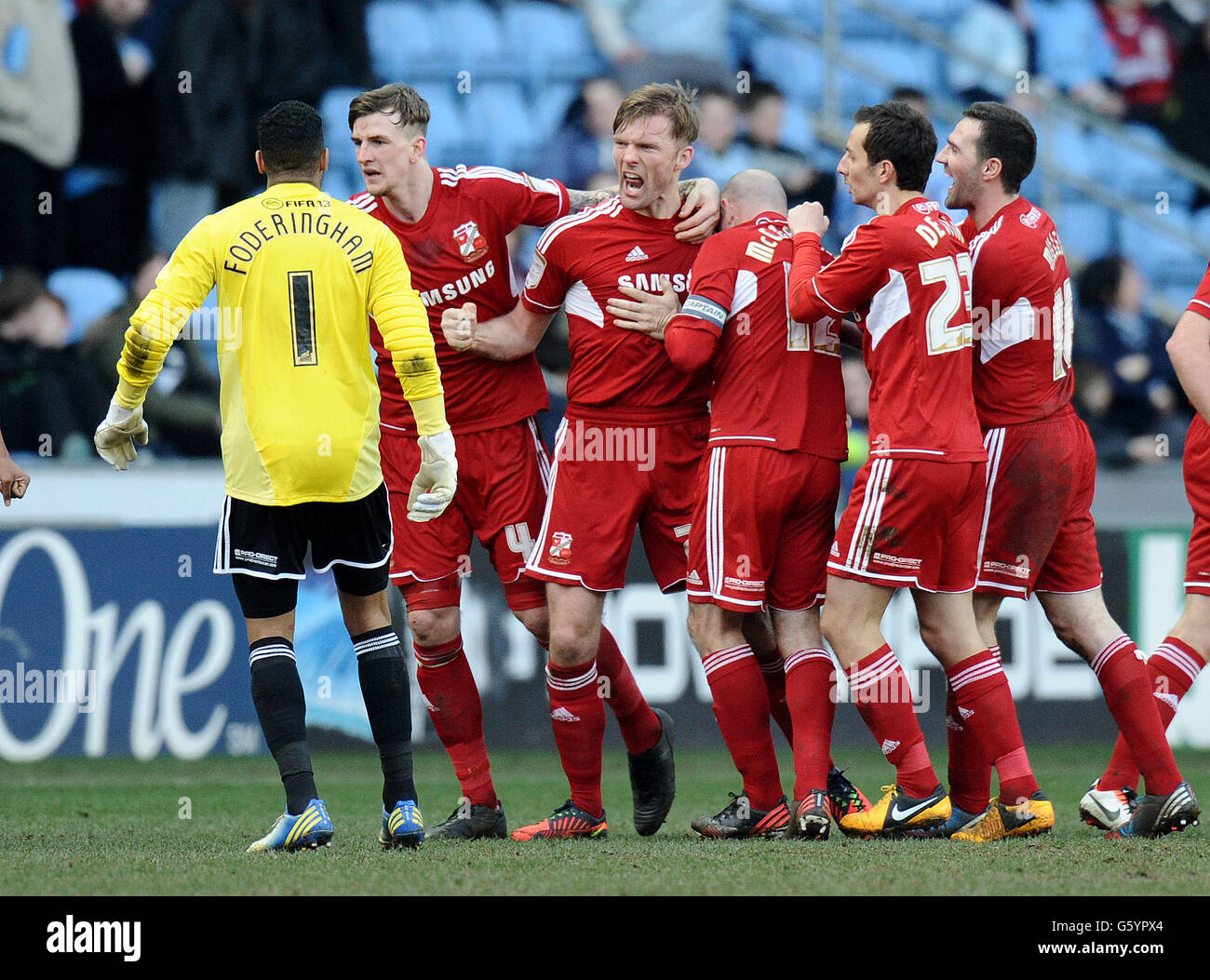 Swindon Town's Darren Ward (3rd from left) celebrates after scoring ...