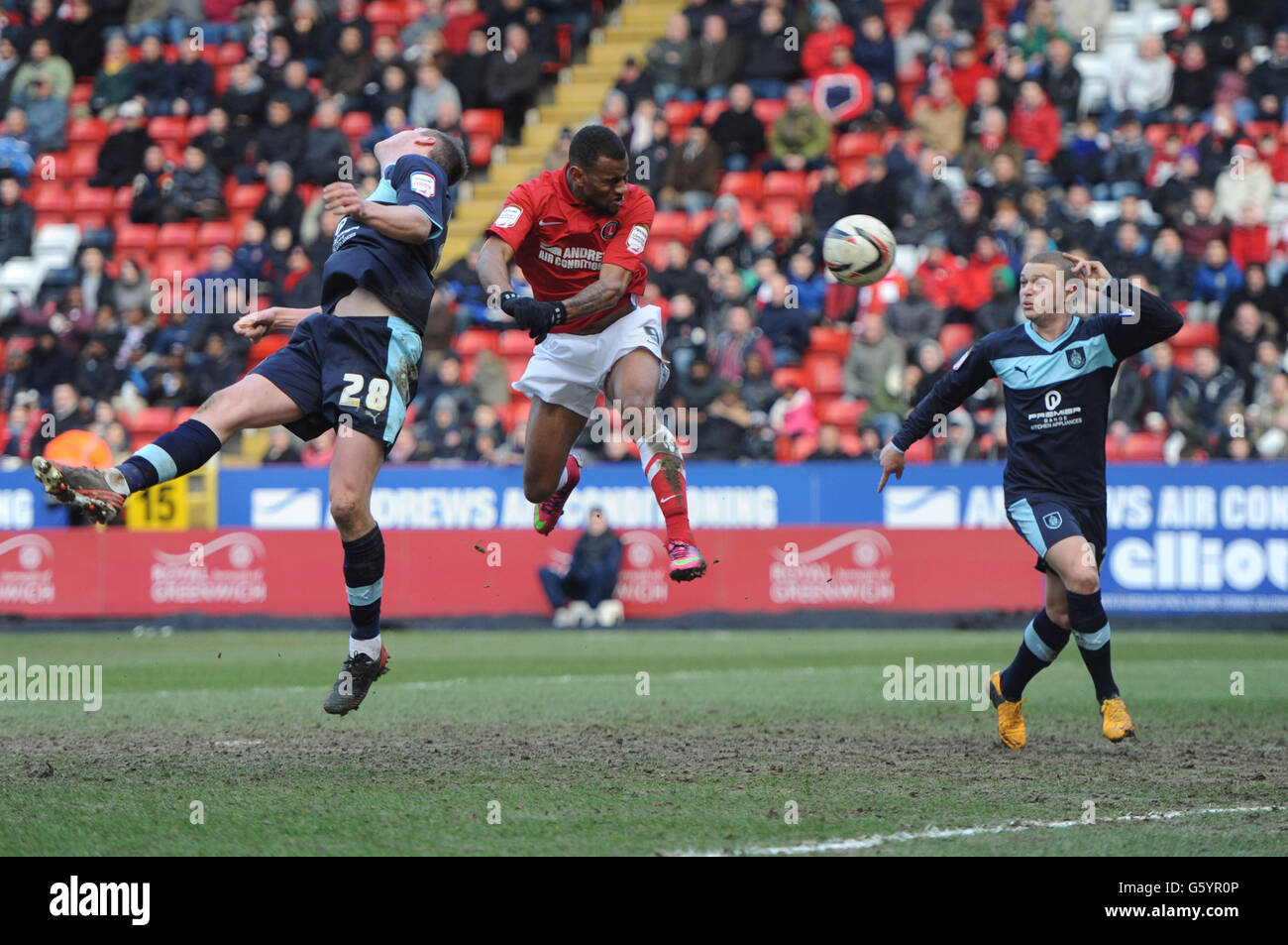 Charlton Athletic's Danny Haynes (centre) heads for goal but this ...