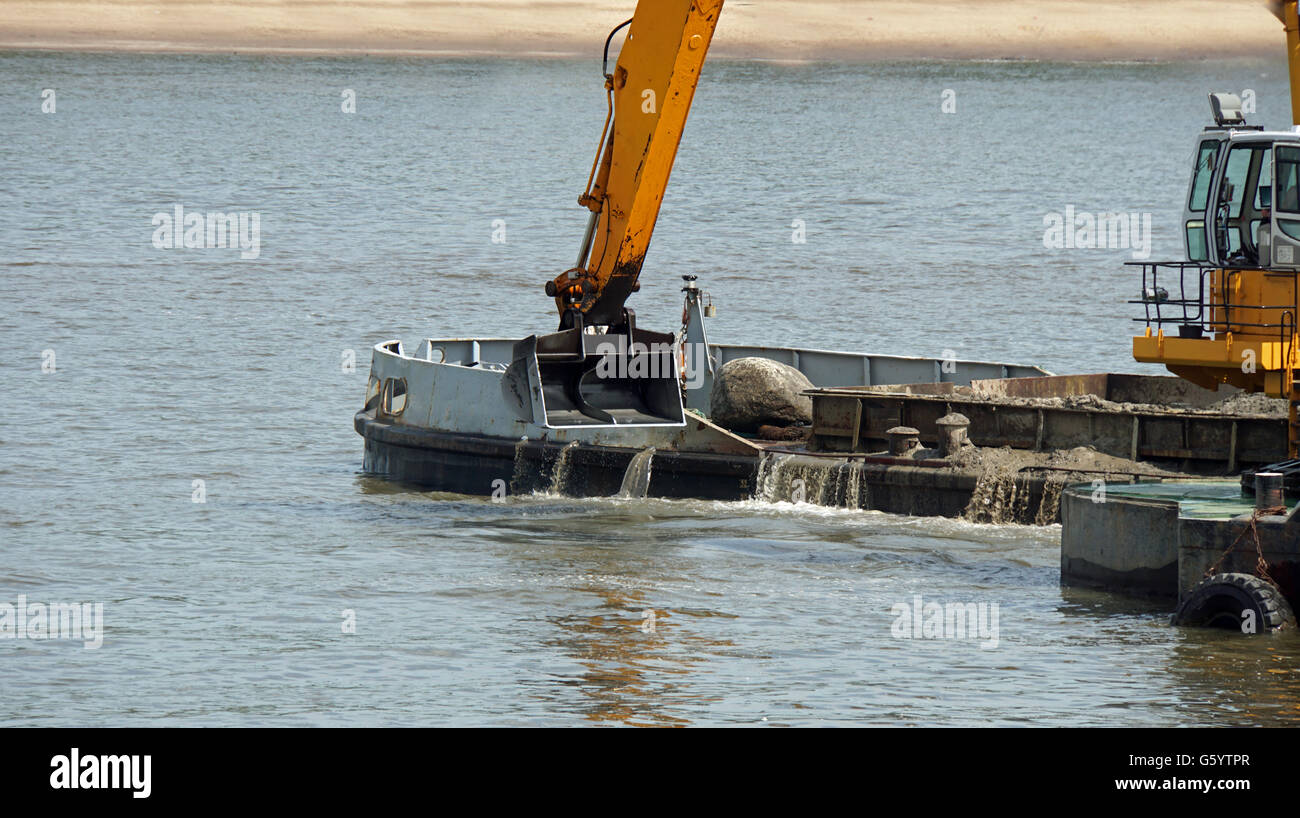 river digging on german river elbe in hamburg Stock Photo - Alamy
