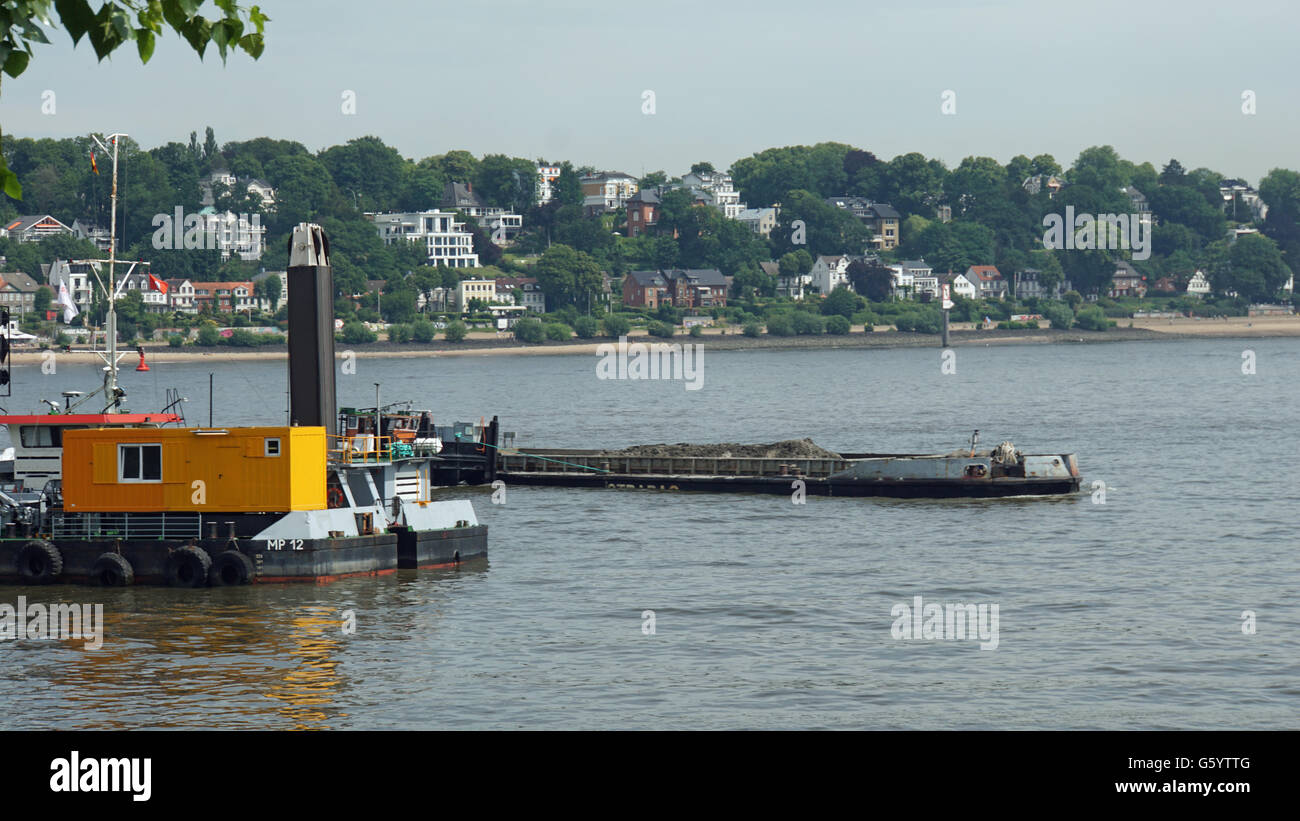 river digging on german river elbe in hamburg Stock Photo - Alamy