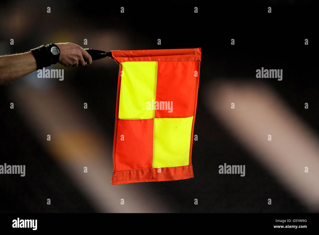 Linesman shows his flag to mark player as offside hi-res stock ...