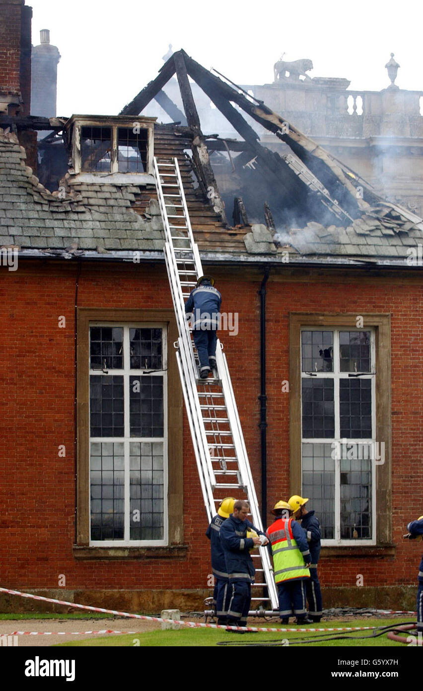 Firefighters survey the fire-damaged house used as an office on Lord ...