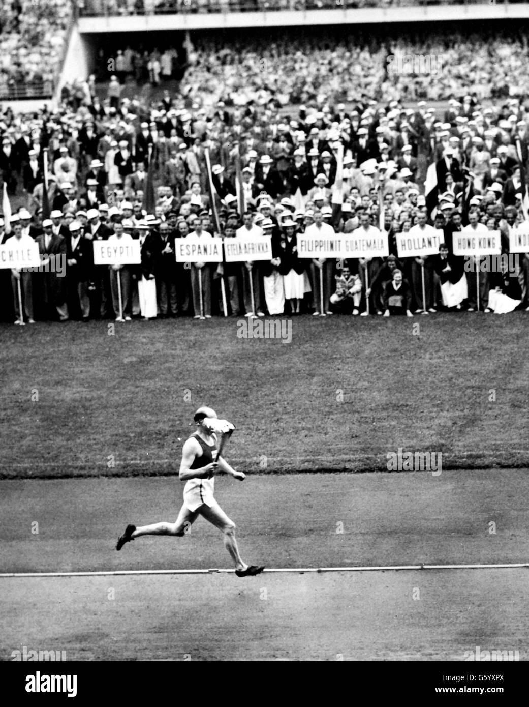 Paavo Nurmi carrying the Olympic torch Stock Photo - Alamy
