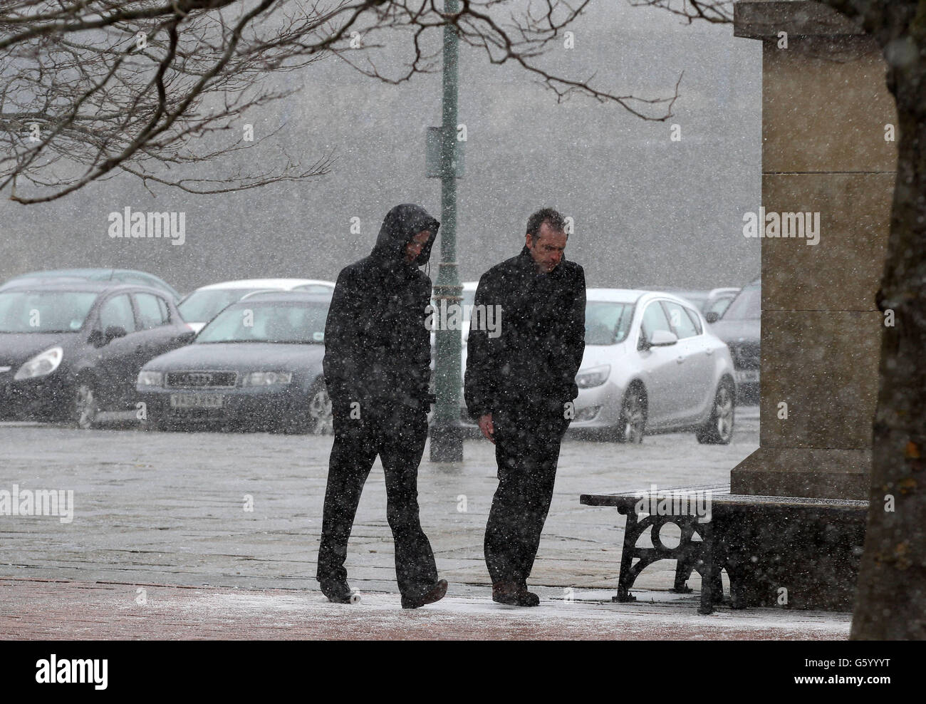 Two men battle against the weather conditions in Bradford, as winter ...