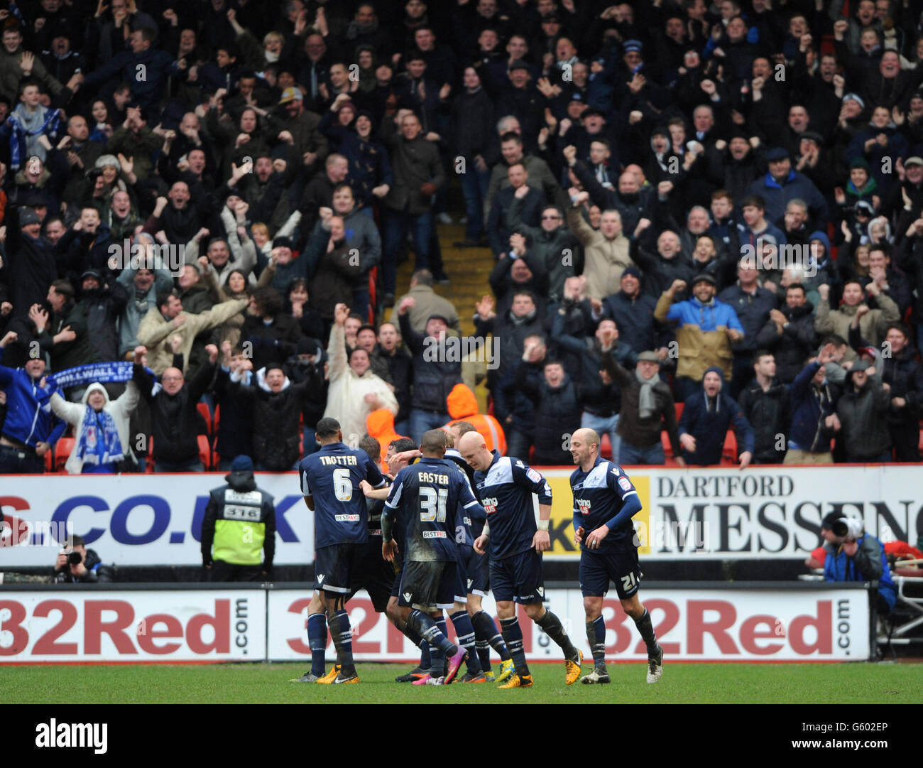 Millwall's players celebrate their second goal along with the away fans ...