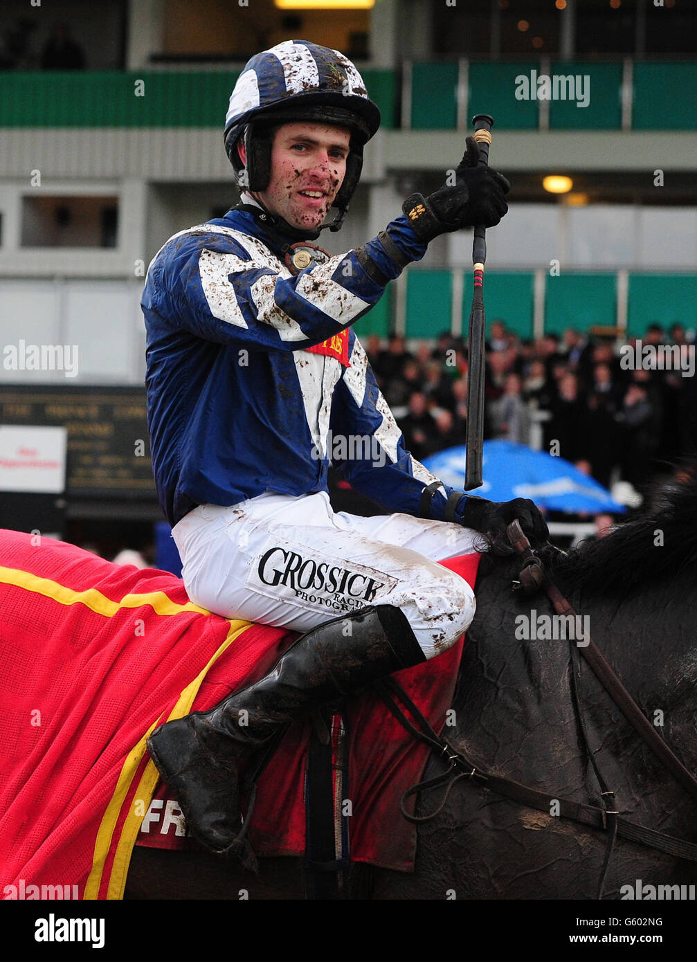 Jockey Michael Ennis gives the thumbs up after winning the Betfred ...