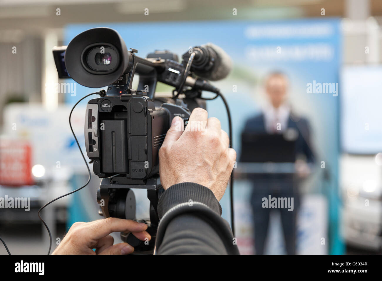 Filming press conference with a video camera. Spokesperson Stock Photo ...