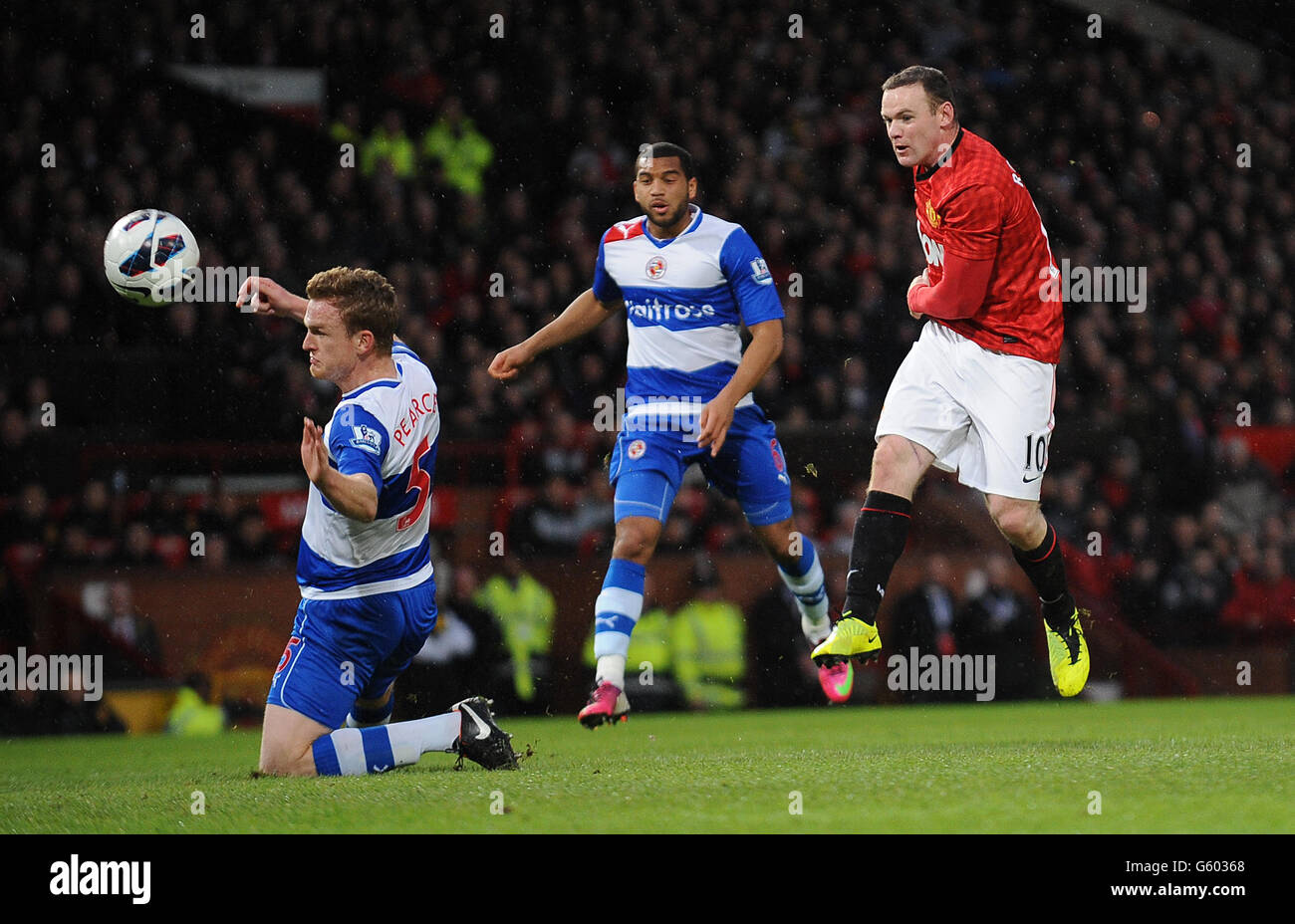 Manchester United's Wayne Rooney (right) scores the opening goal of the ...