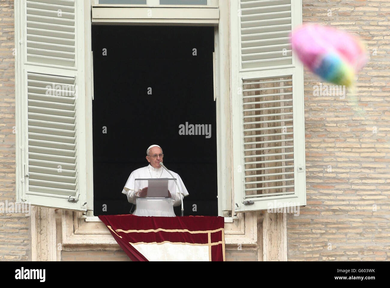 Pope Francis delivers his Angelus prayer from the window of his studio ...