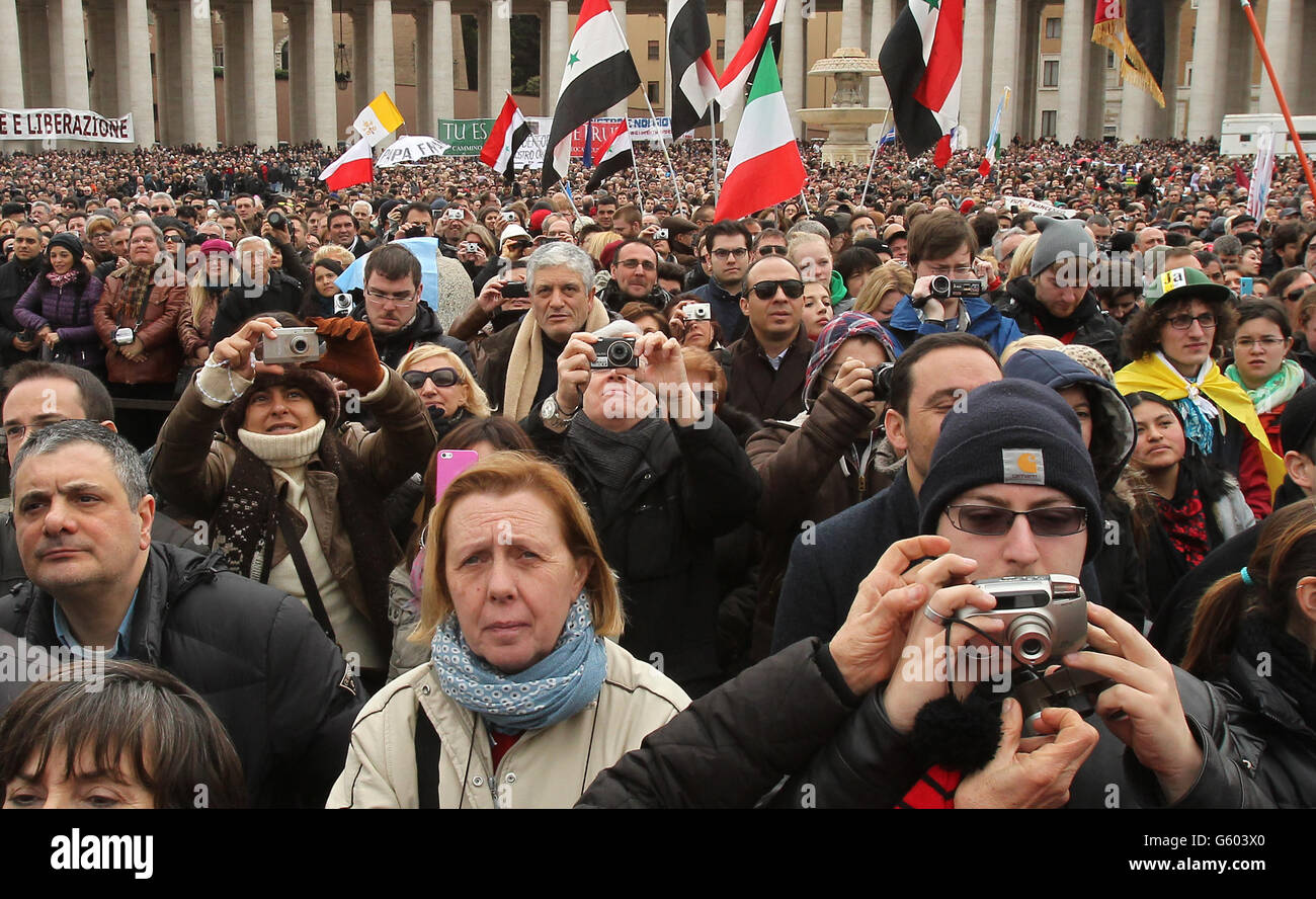 Crowds take pictures as Pope Francis delivers his Angelus prayer from ...