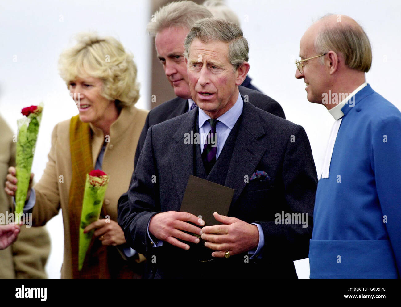 The Prince of Wales speaks to the Reverend I Macnee during a visit with ...