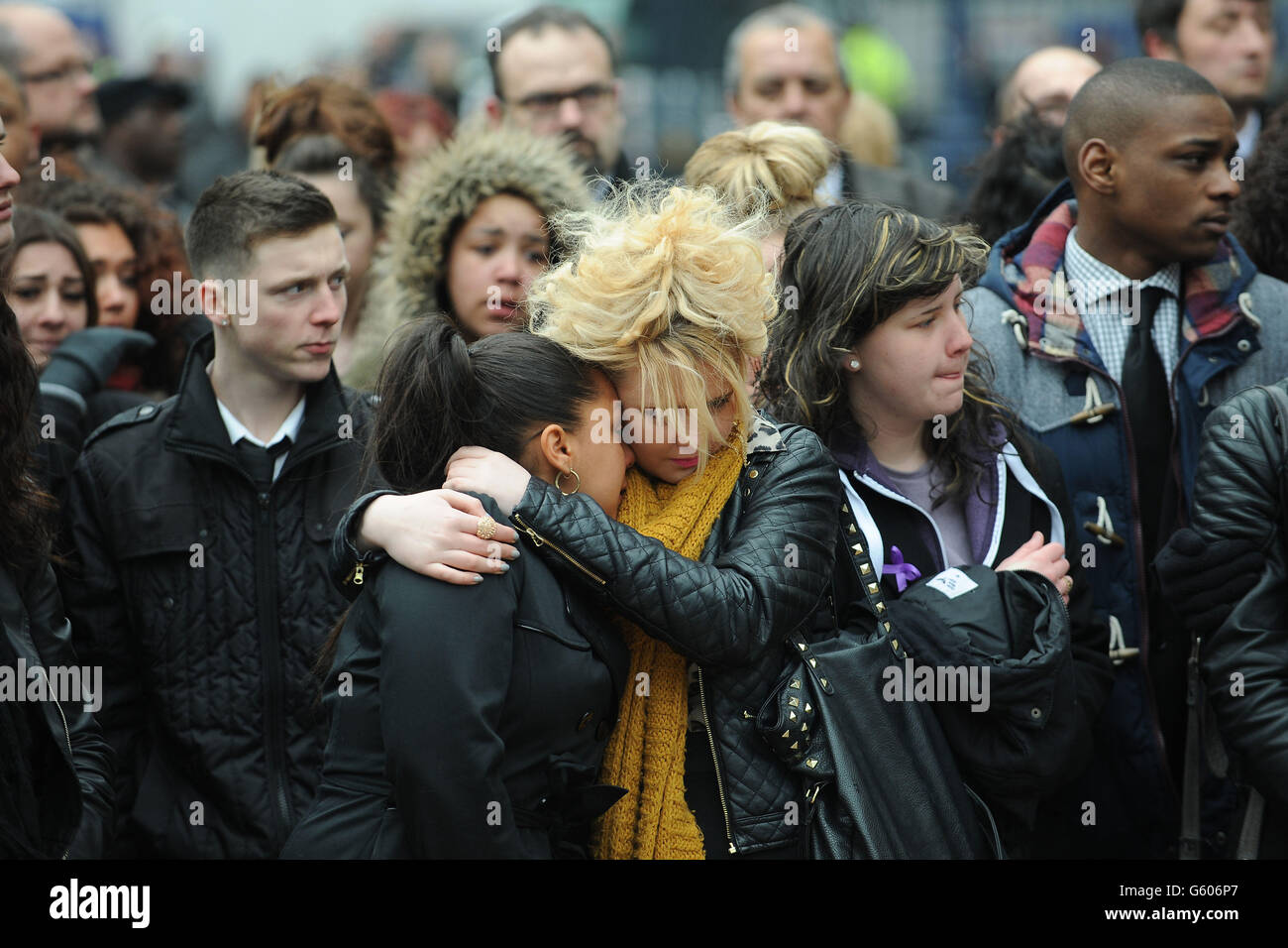 Mourners console each other during the funeral of Christina Edkins at ...