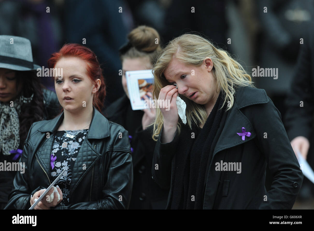 Christine Edkins Funeral. Mourners console each other during the ...