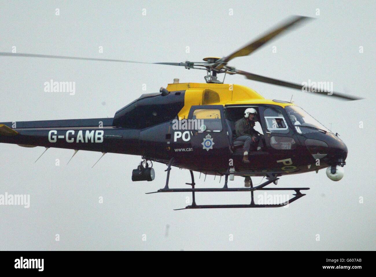 The Cambridgeshire police helicopter, with an officer taking images as ...
