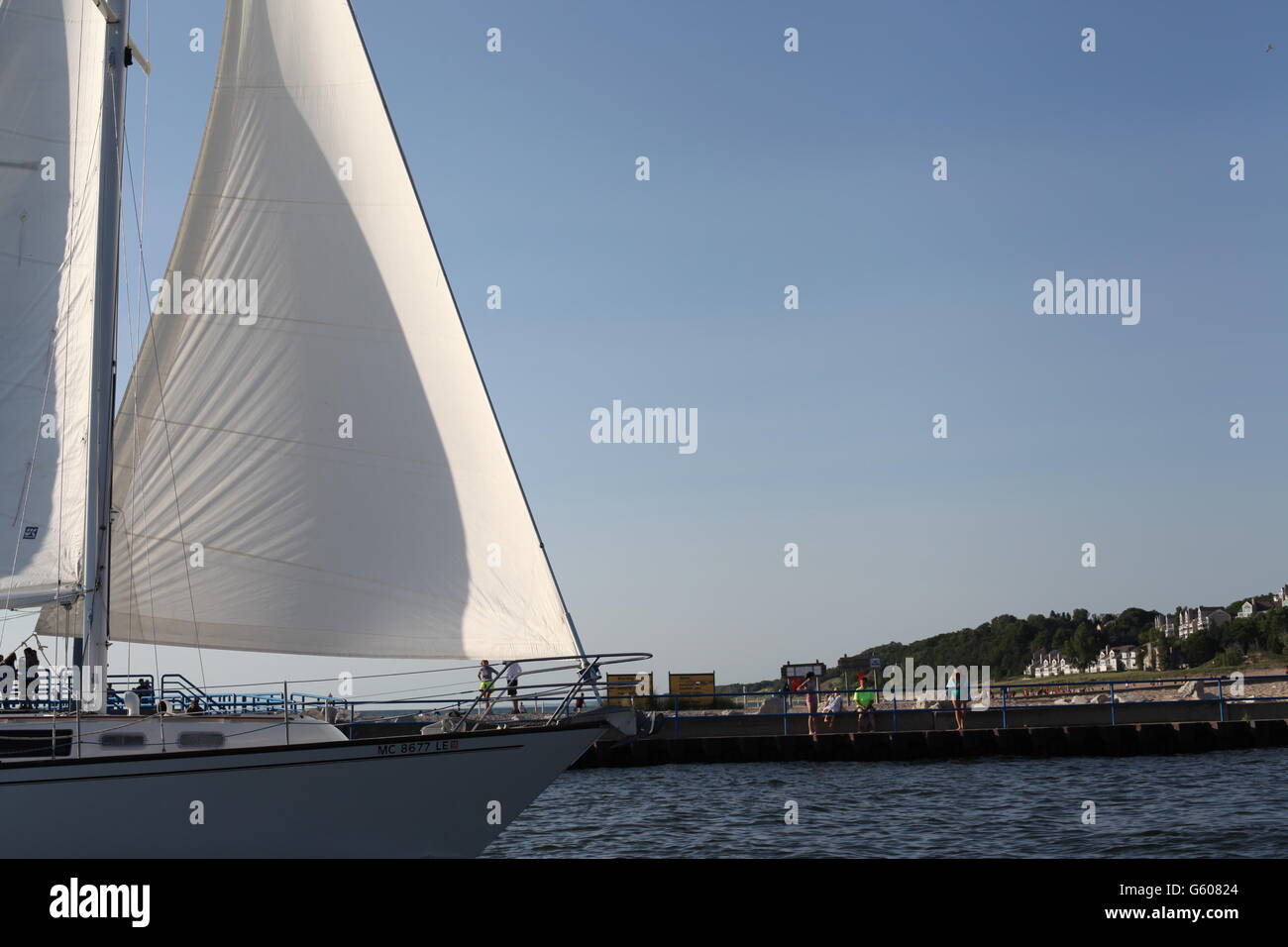 sailboat sail going through lake channel Stock Photo - Alamy