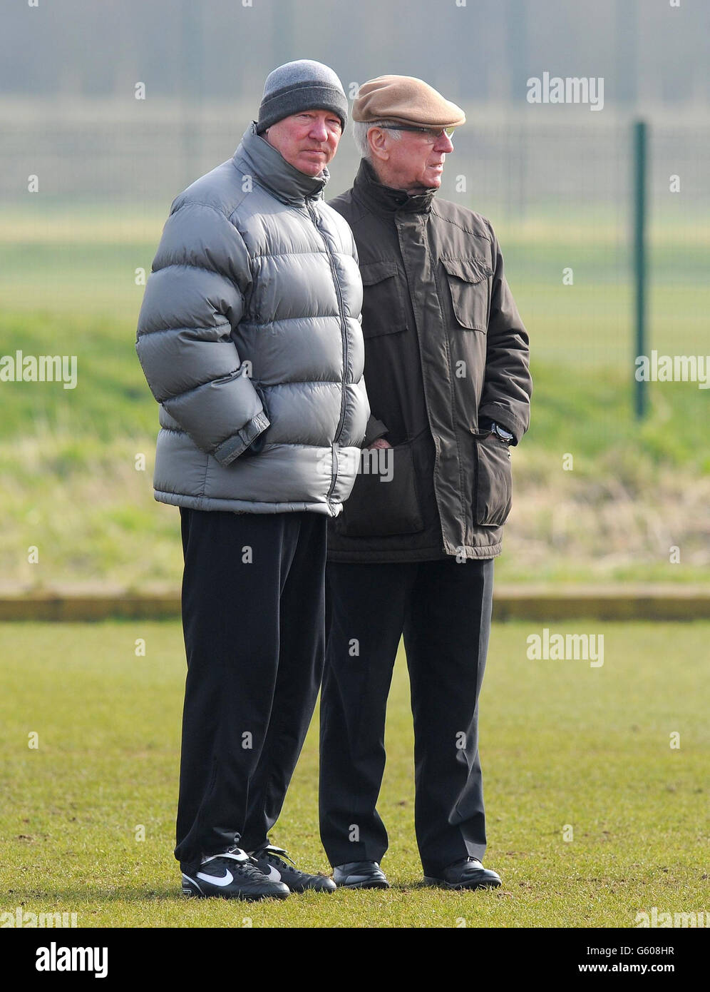 Manchester United manager Sir Alex Ferguson (left) watches his players ...