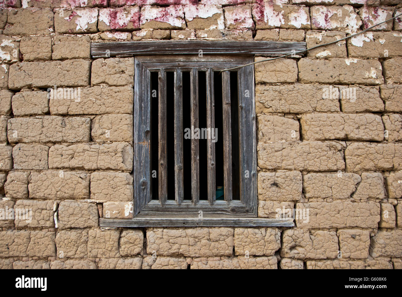 Ancient window on mud brick wall - Aged window on mud brick wall Stock ...