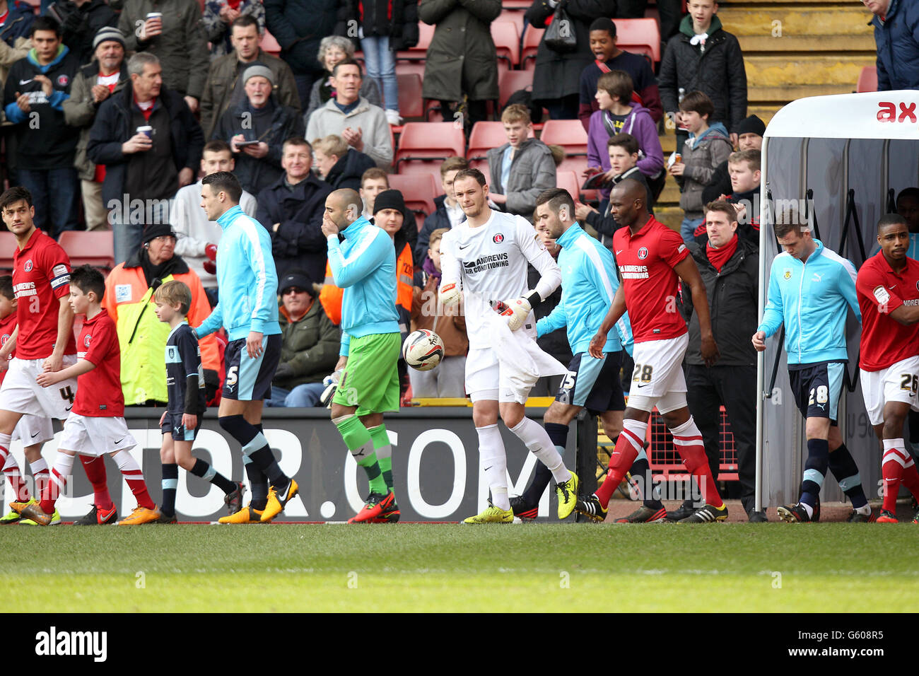 Charlton Athletic goalkeeper David Button (centre) makes his way out of ...