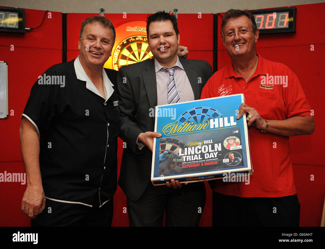 Wayne Skinner (centre) receives his prizes from Keith Deller (left) and ...