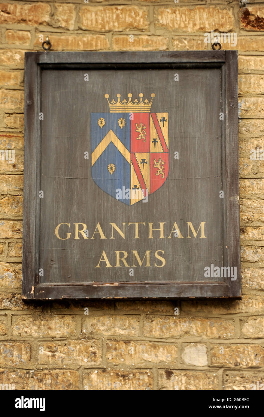 General view of a sign for the Grantham Arms above a house in Bampton ...