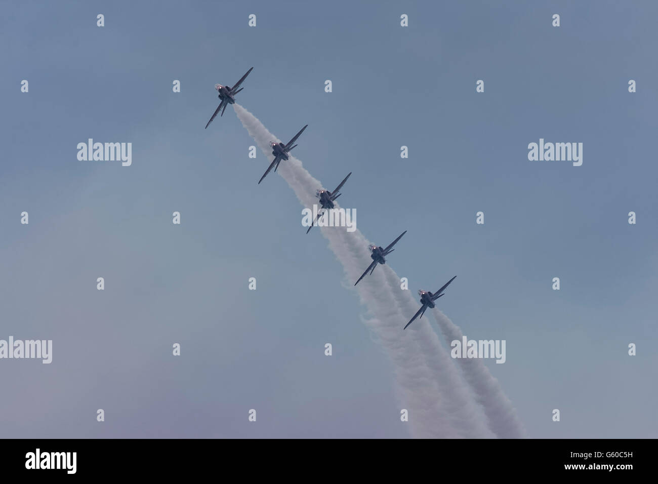 RAF Red Arrow Hawk Jets in flight in the sky Stock Photo - Alamy