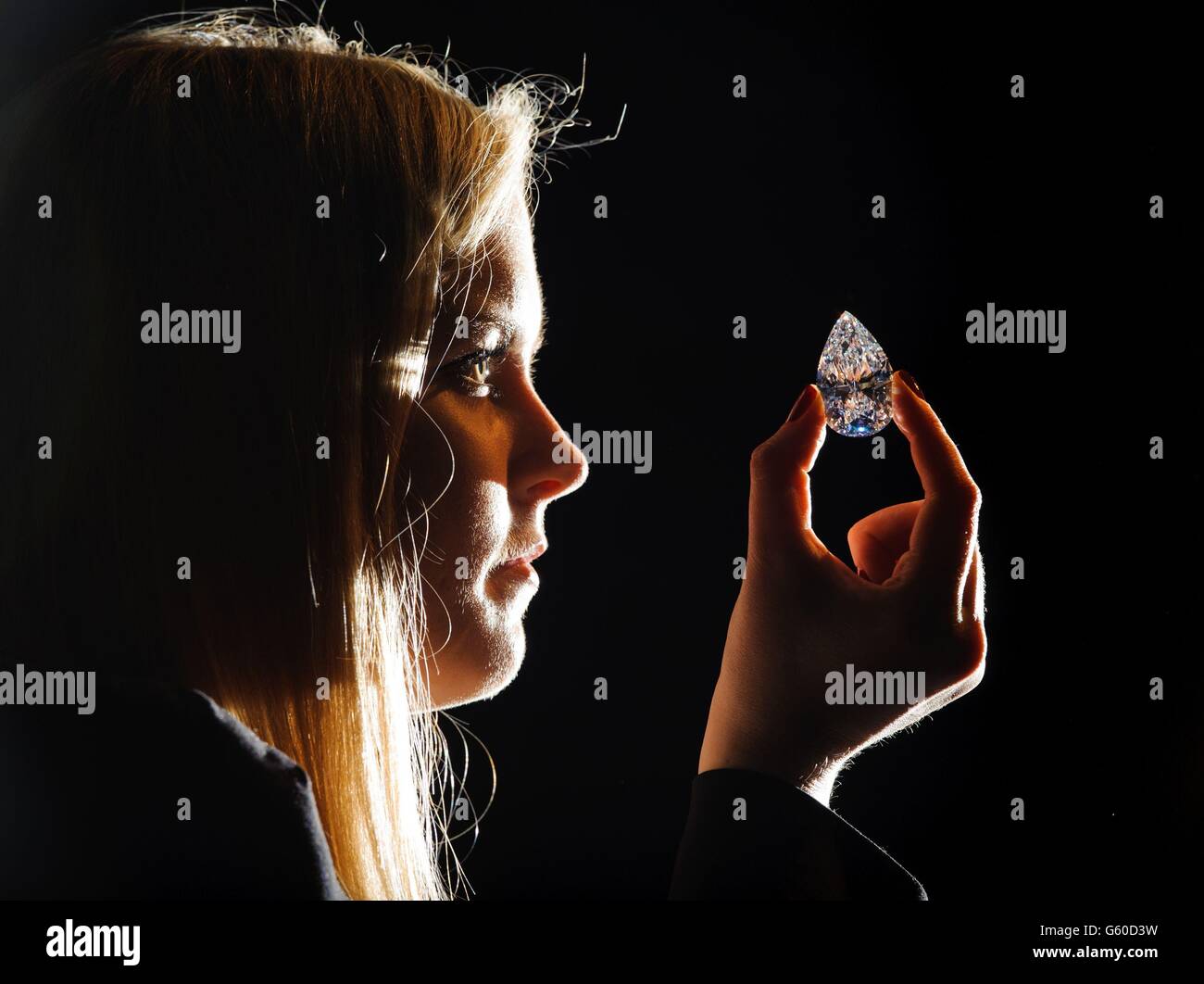 A Christie's employee (name withheld) holds a 101.73 carat pear-shaped ...
