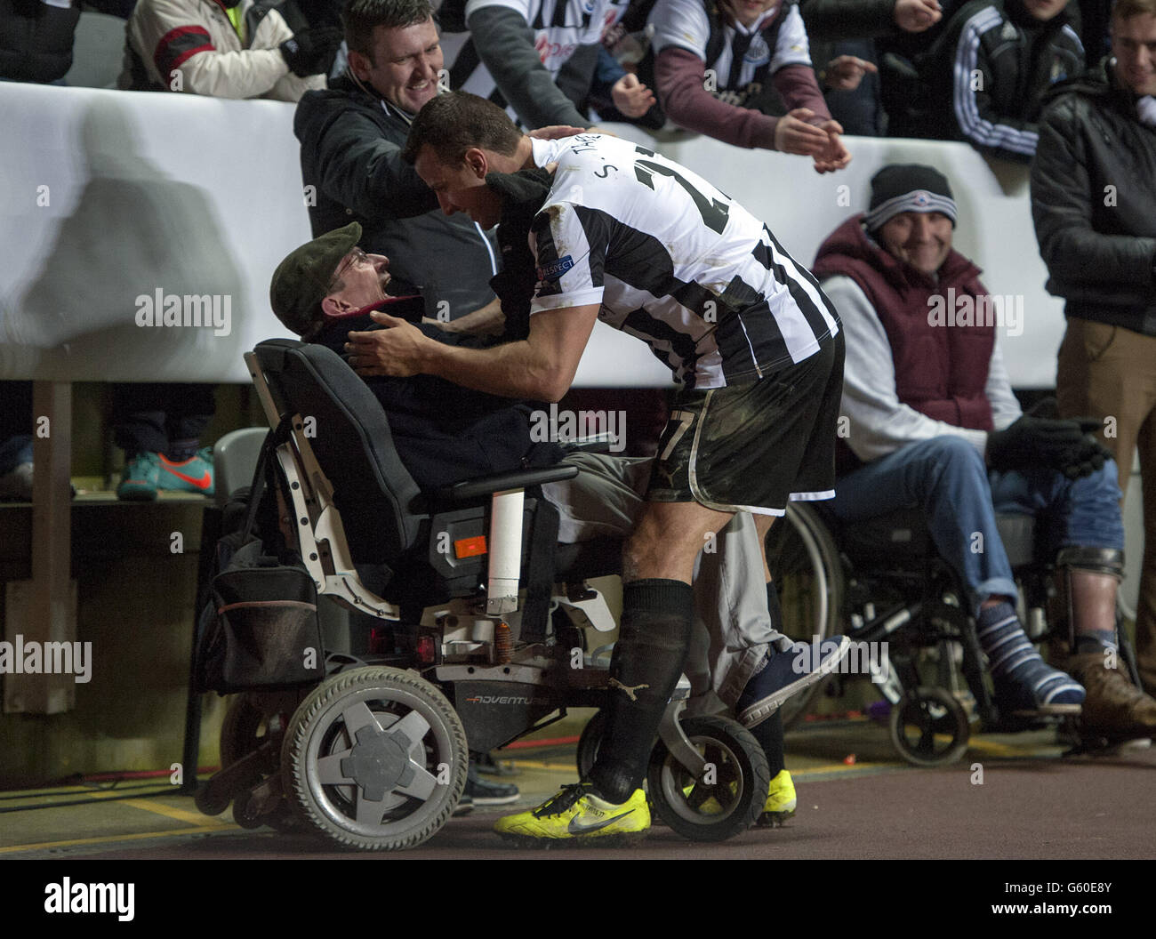 Newcastle United's Steven Taylor celebrates with a disabled fan after ...