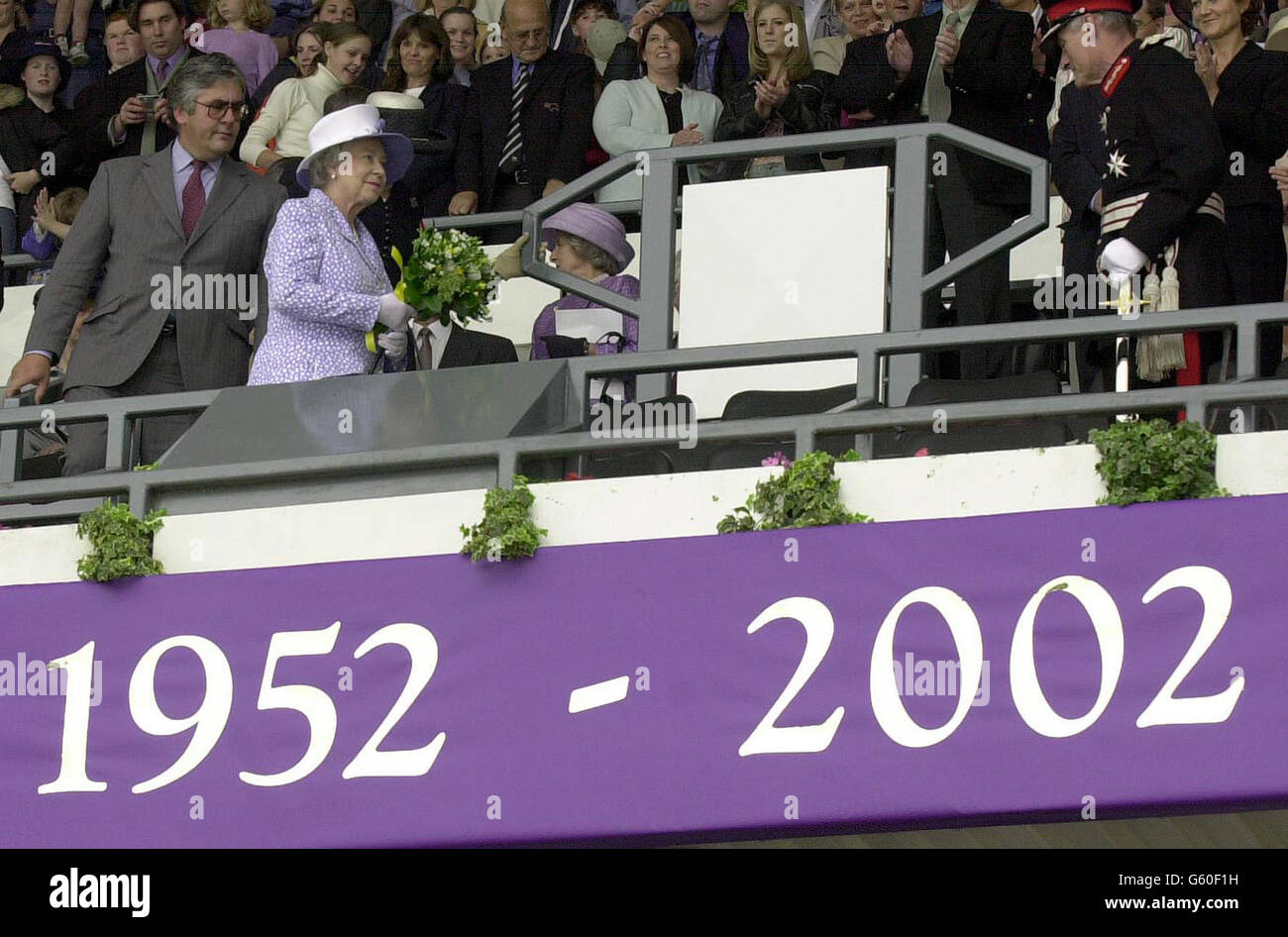 The Queen arrives in the directors' box at Pride Park, the home of ...