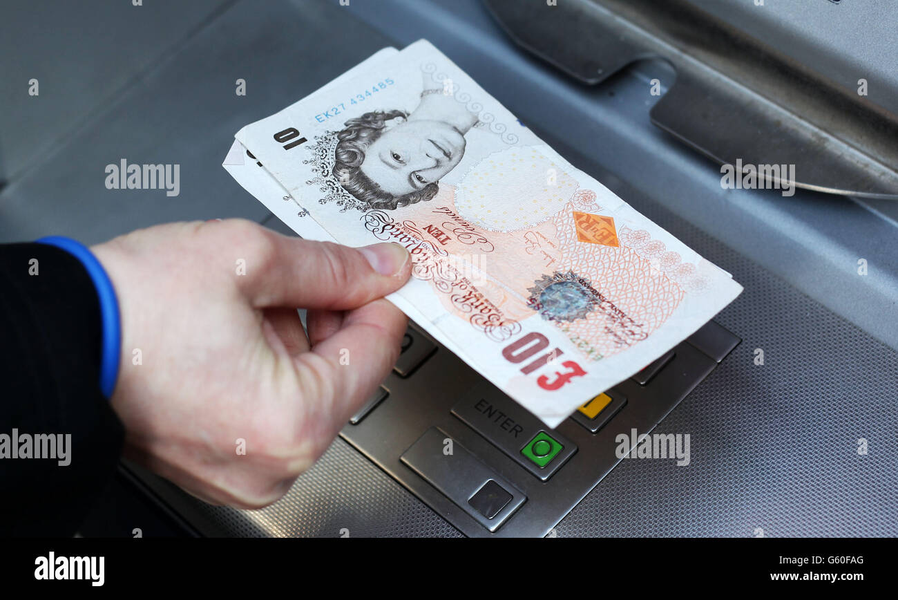 General view of money being taken out of cash machine hi-res stock ...