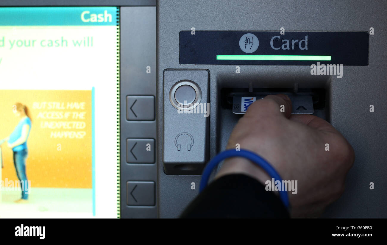 Money being taken out cash machine hi-res stock photography and images ...