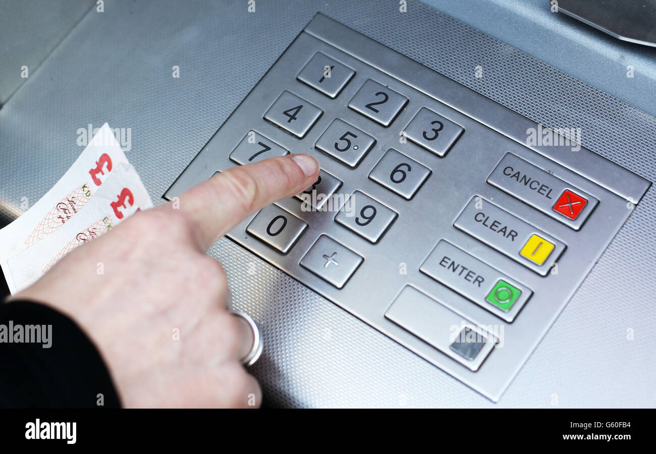 General view of money being taken out of cash machine hi-res stock ...