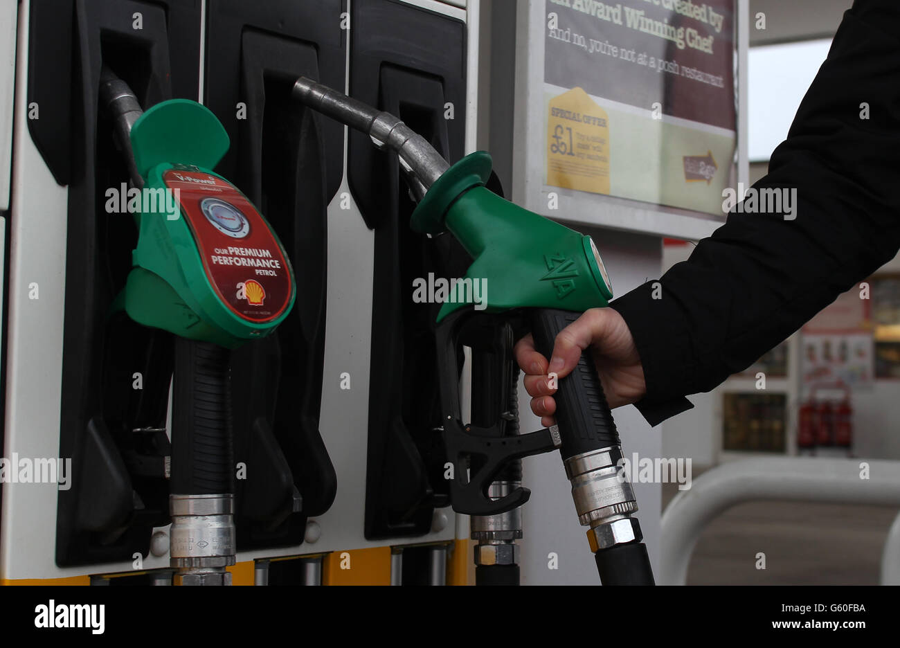 Petrol stock. Motorist fills up with petrol at a forecourt Stock Photo ...