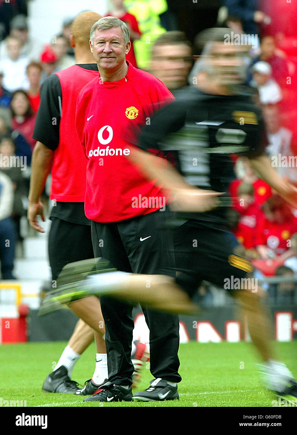 Manchester United manager Sir Alex Ferguson watches his players during ...