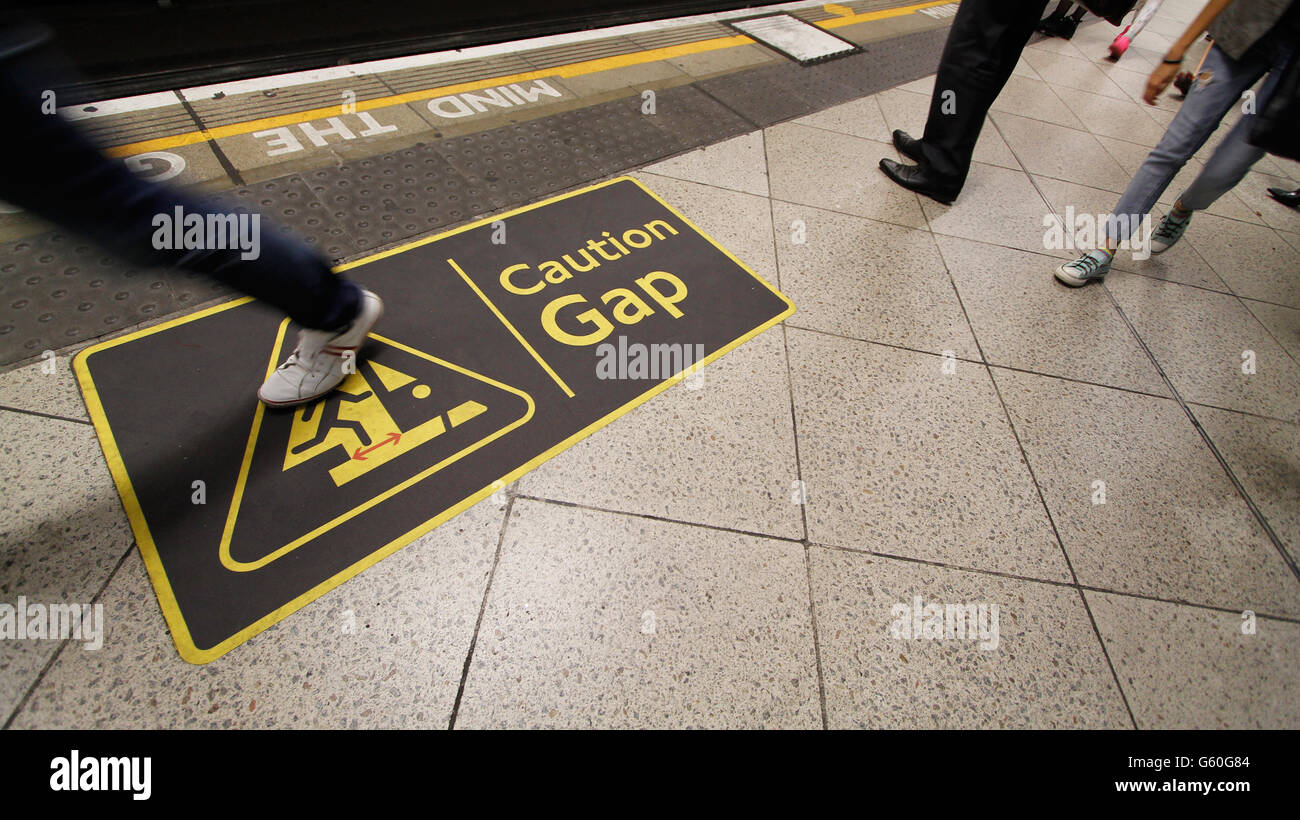 Mind the gap and Caution gap, sign on London underground tube network ...