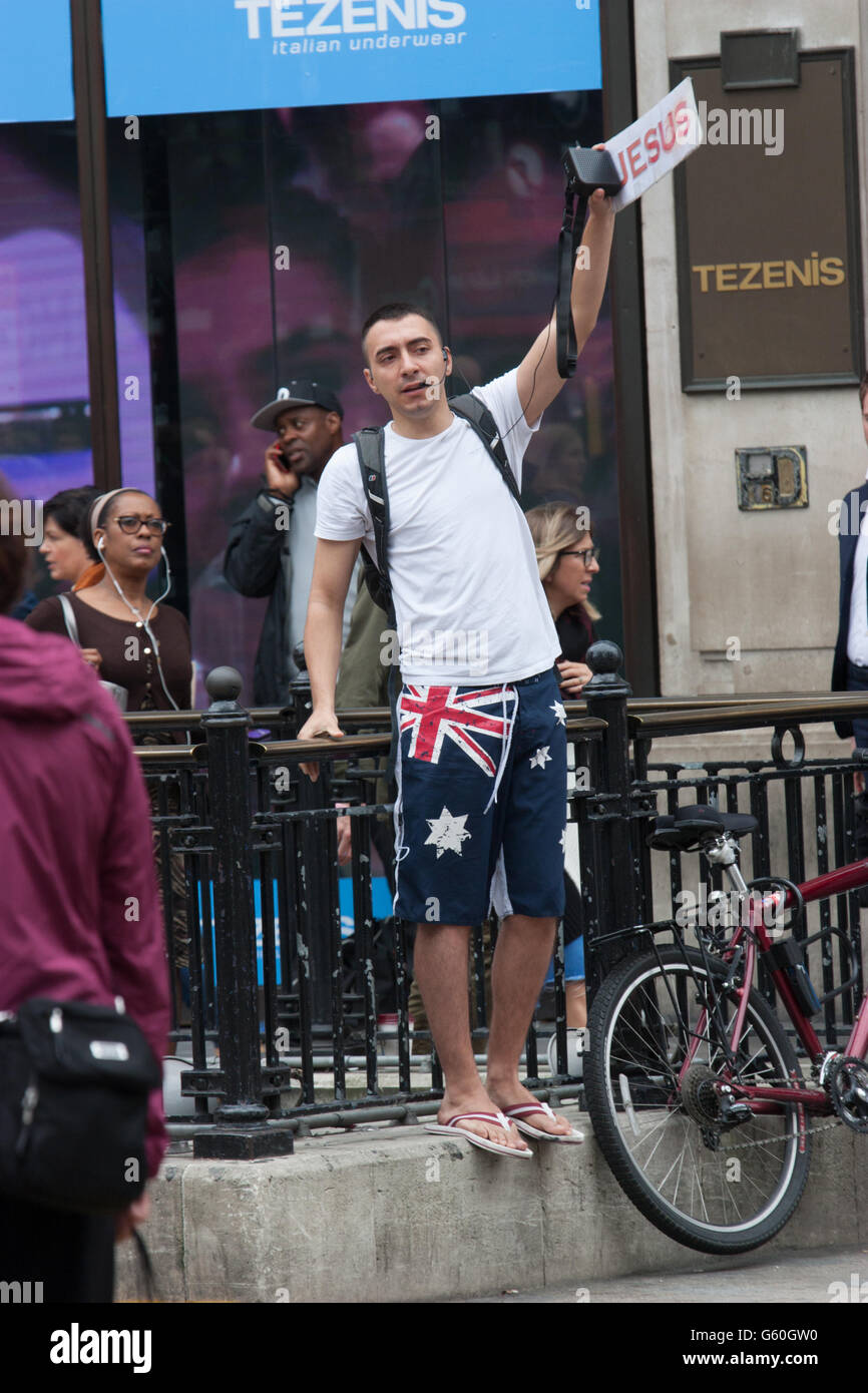Religious preacher with Jesus poster preaching in Oxford Street London ...